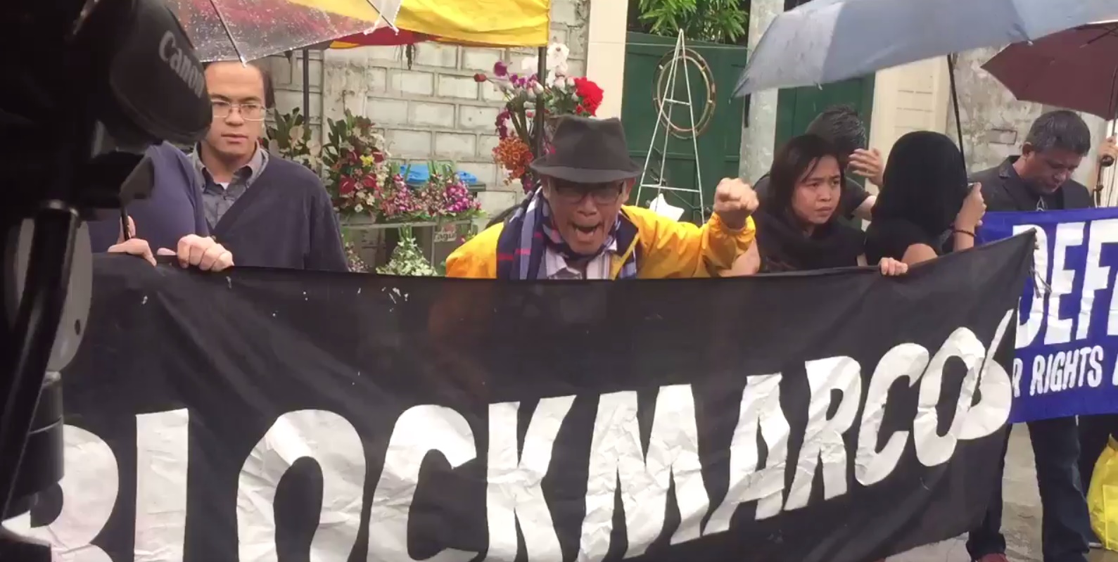 Amid downpour, protesters hold program at Marcos 100th birthday ...