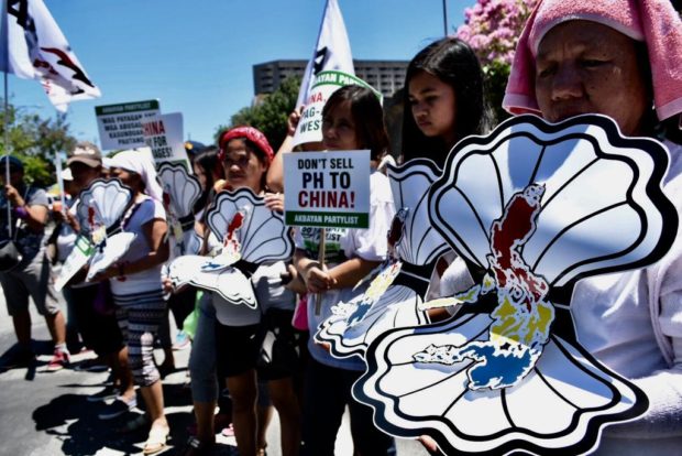 LOOK: Akbayan protests Chinese incursion in West Philippine Sea ...