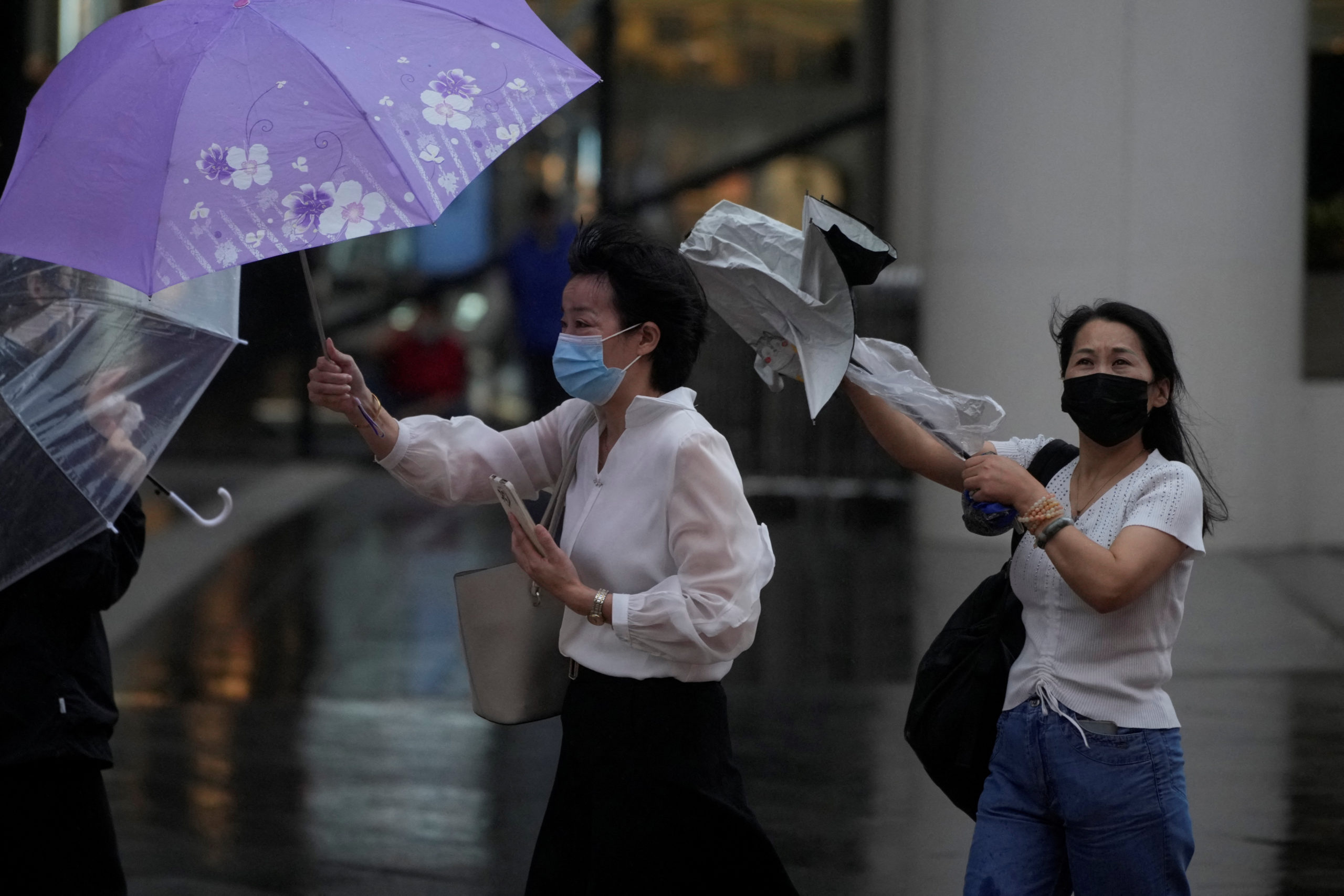 Typhoon Muifa downgraded to strong tropical storm, but rain, floods ...