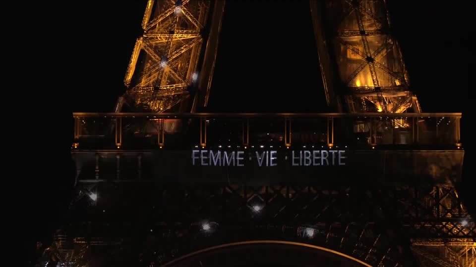 Paris' Eiffel Tower lights up with slogans in solidarity with Iranians ...