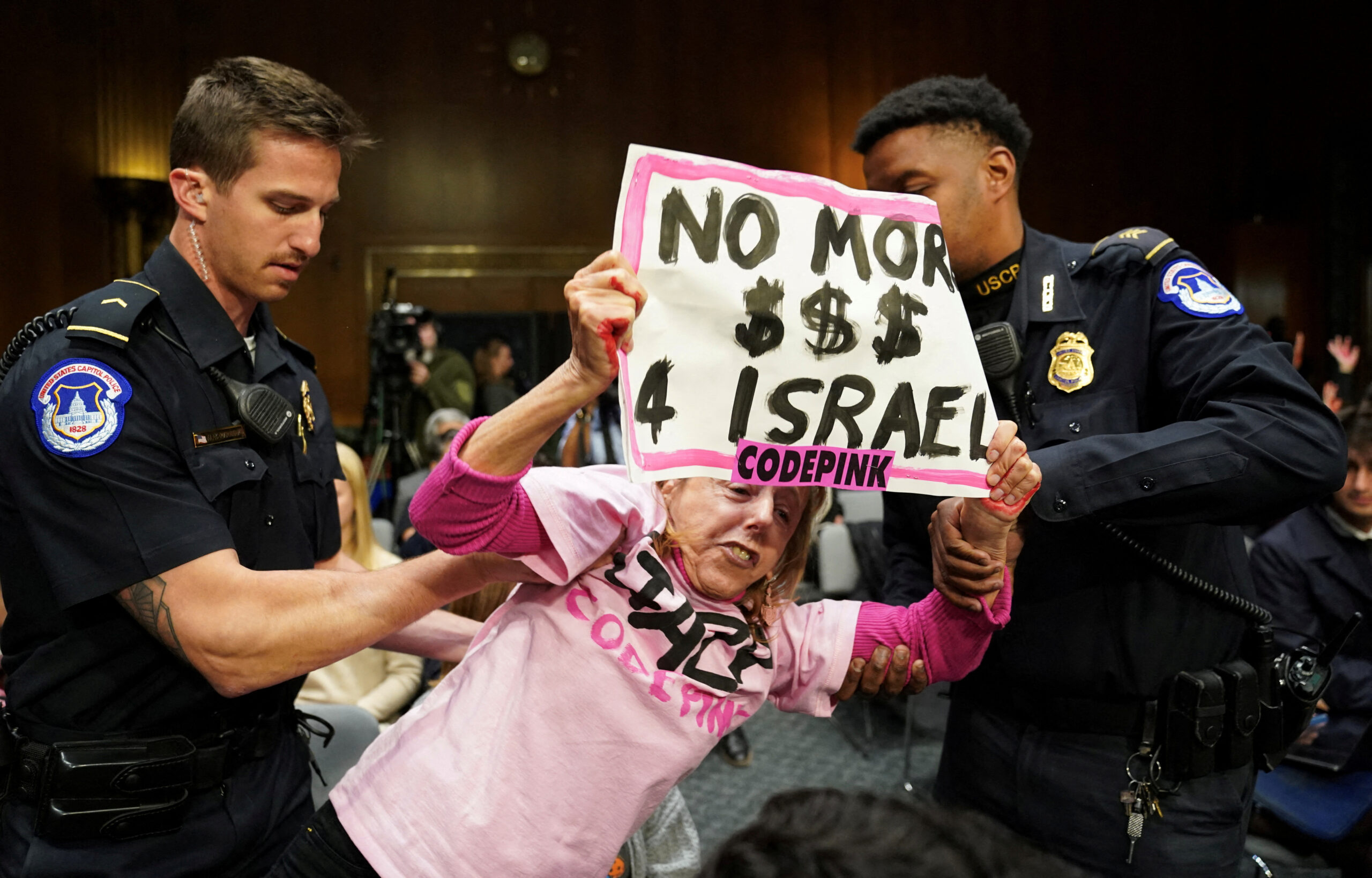 Anti-war protest hits US Congress hearing as Biden officials seek aid ...