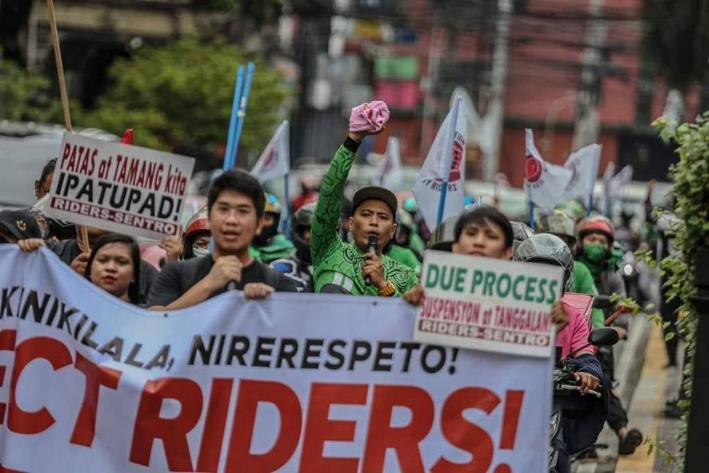 Hundreds of riders protest Grab's new fare policy | Inquirer News