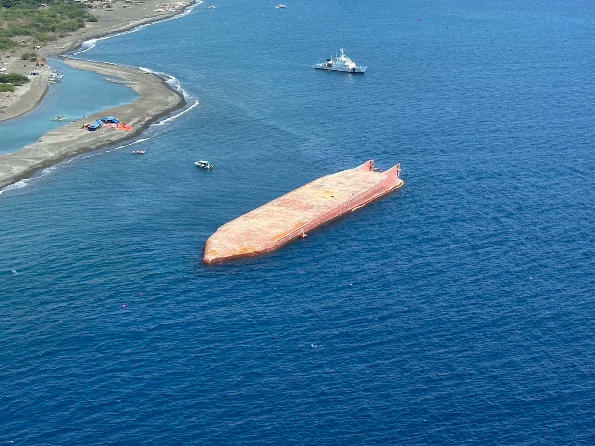 Sand vessel capsizes; 2 dead, 9 of 25 crewmen still missing