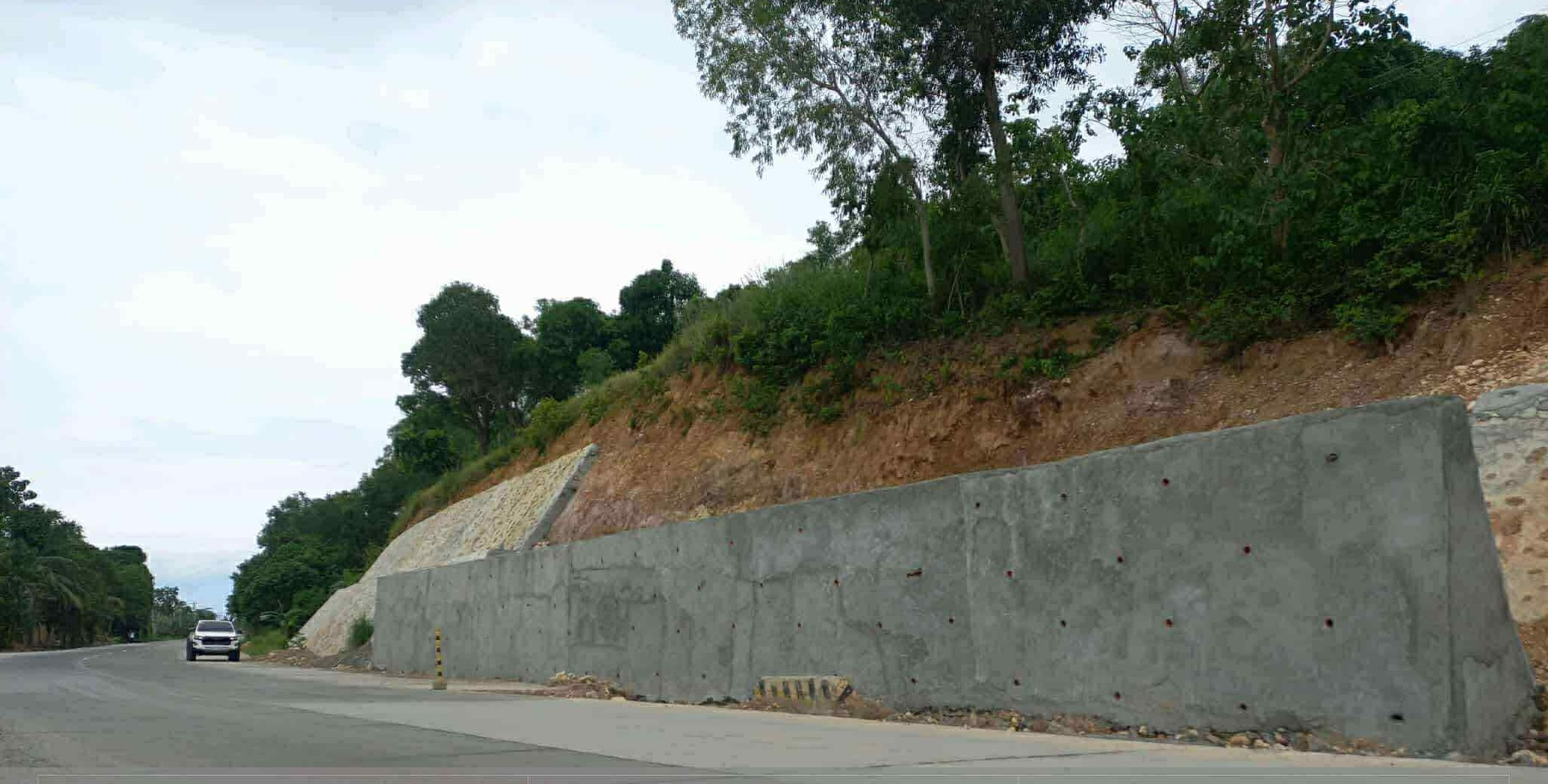 DPWH assures repair underway for rain-damaged slope protection