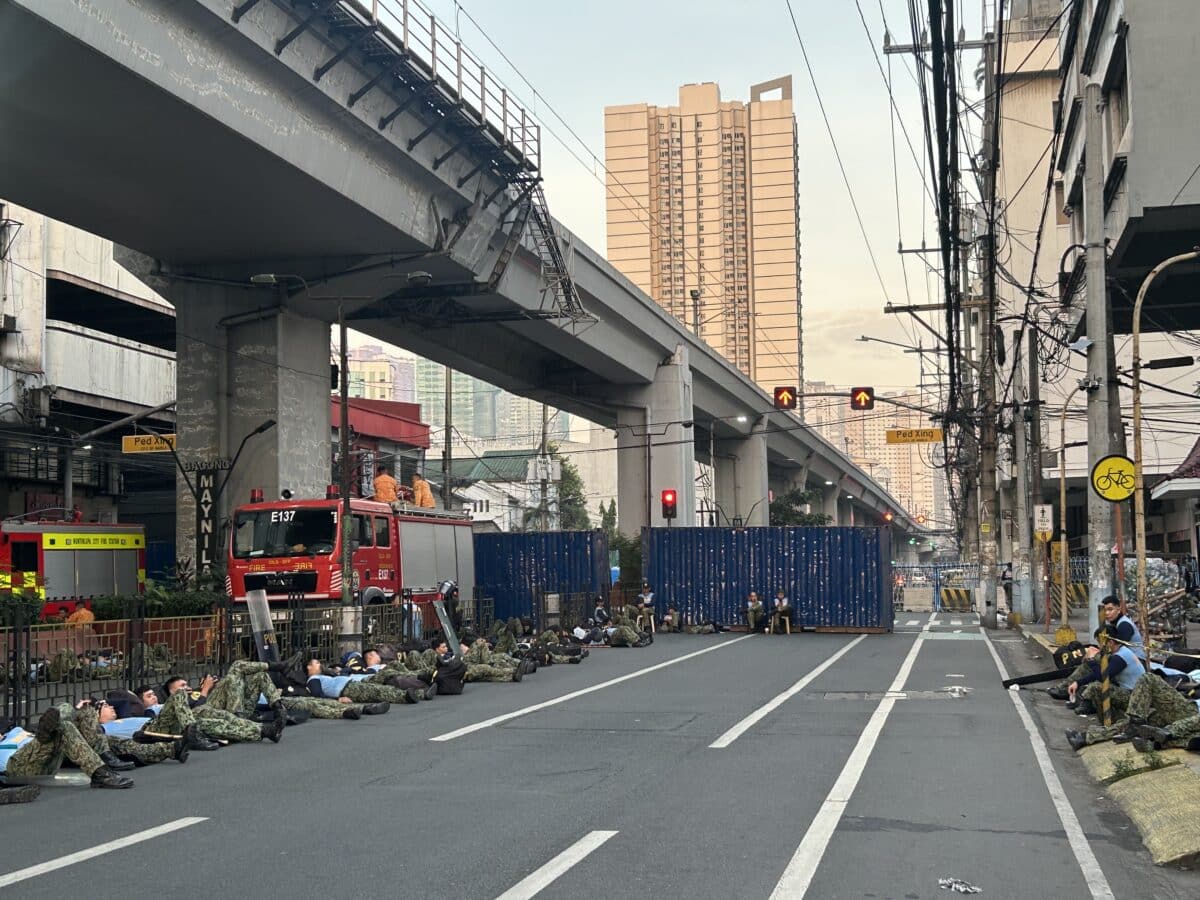 Mendiola Peace Arch blocked by shipping containers, barbed wire