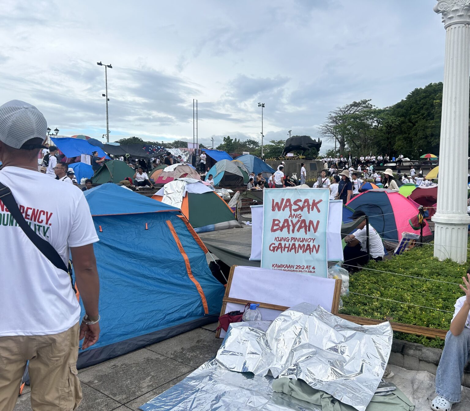 Camping, makeshift tents set up for Day 2 of INC rally